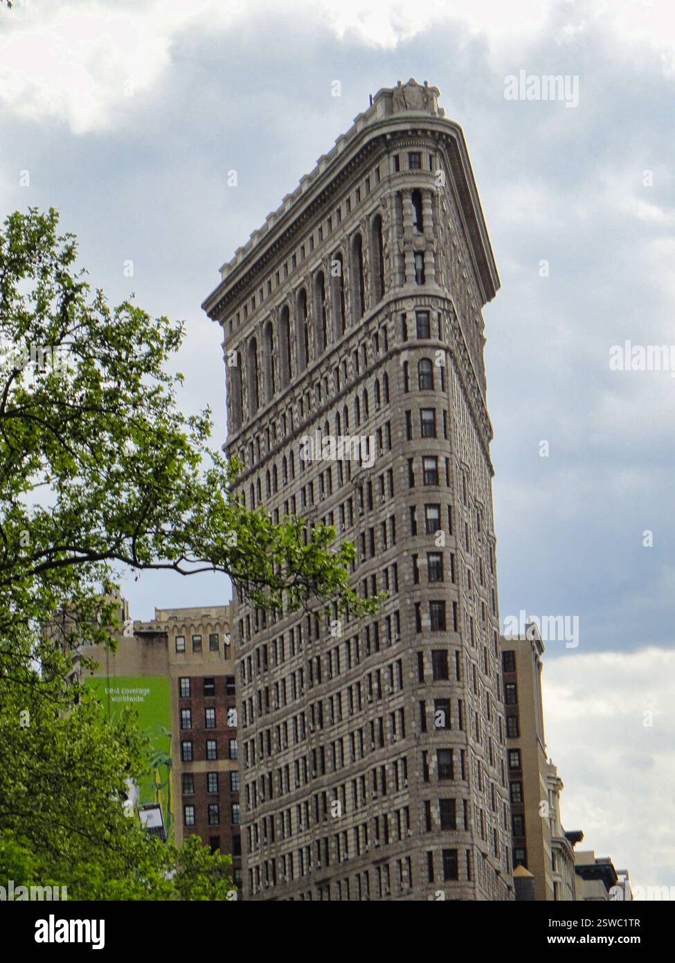 Skyscraper with a tree in front, urban design blending nature in the ...