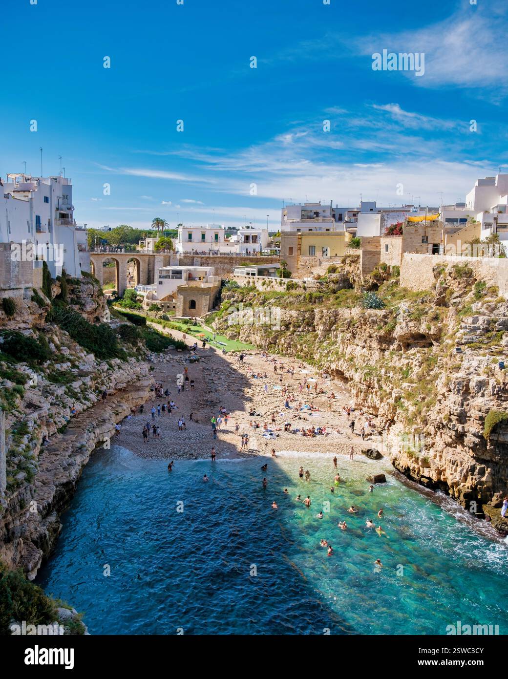 Polignano a Mare hidden beaches of Puglia, Italy on a bright sunny day ...