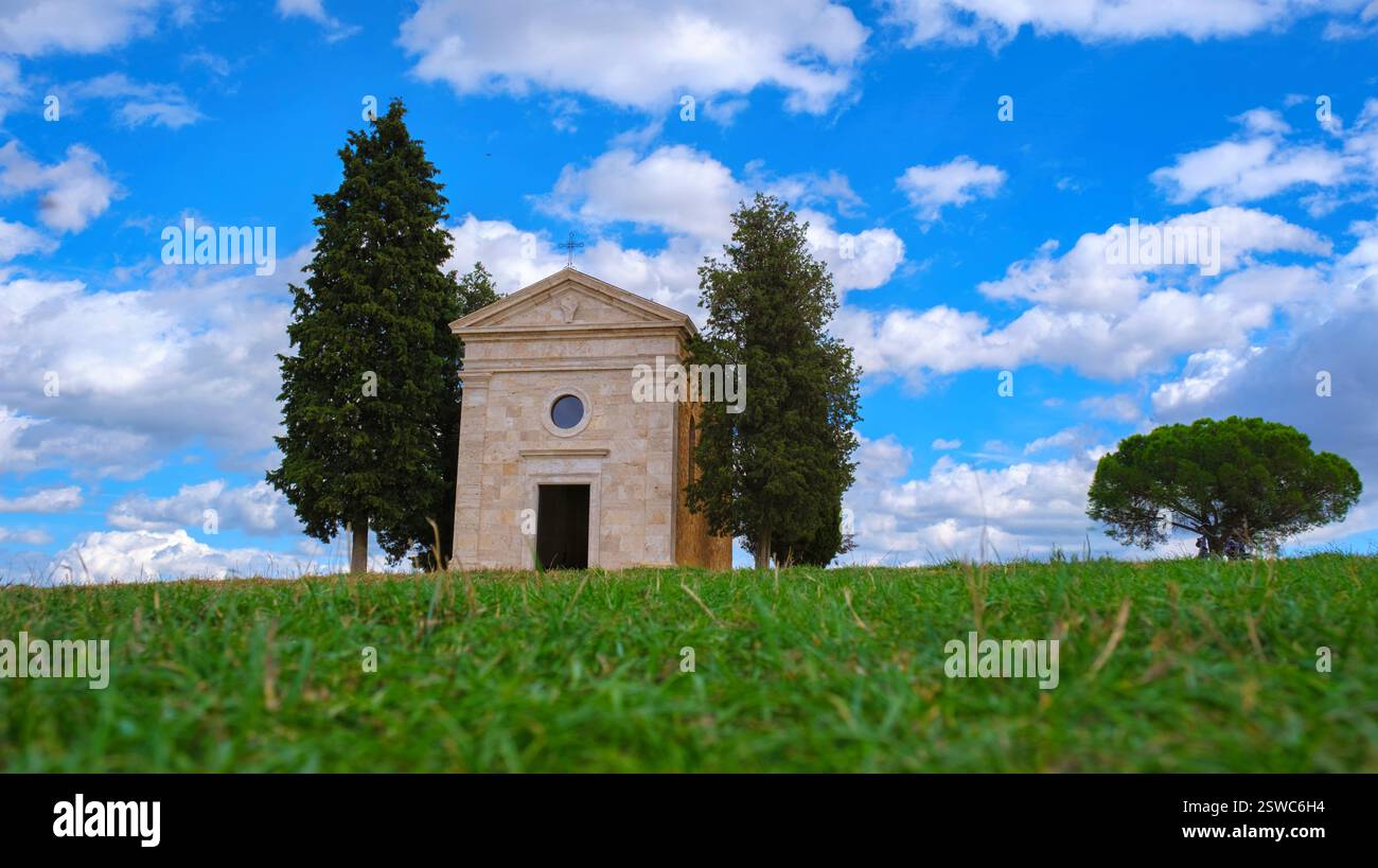 A charming rural chapel under the expansive Tuscan skies in Italy ...