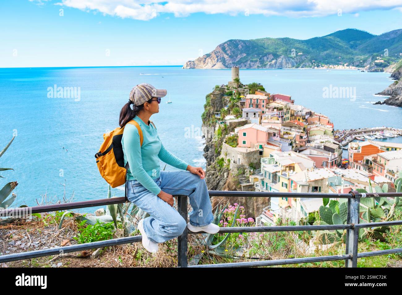 Enjoying the breathtaking view of Cinque Terre's colorful cliffside ...