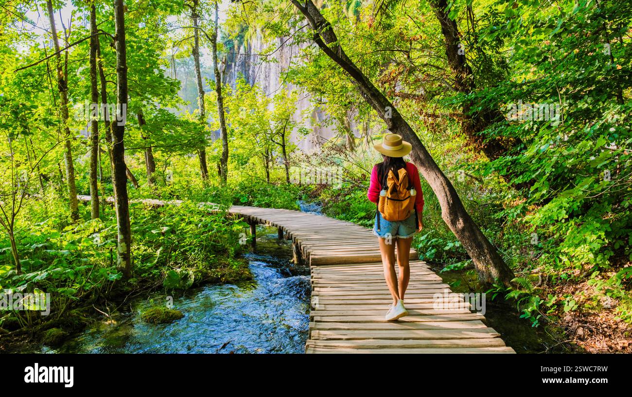 Exploring the enchanting Plitvice Lakes in Croatia amidst lush greenery and serene waters Stock ...