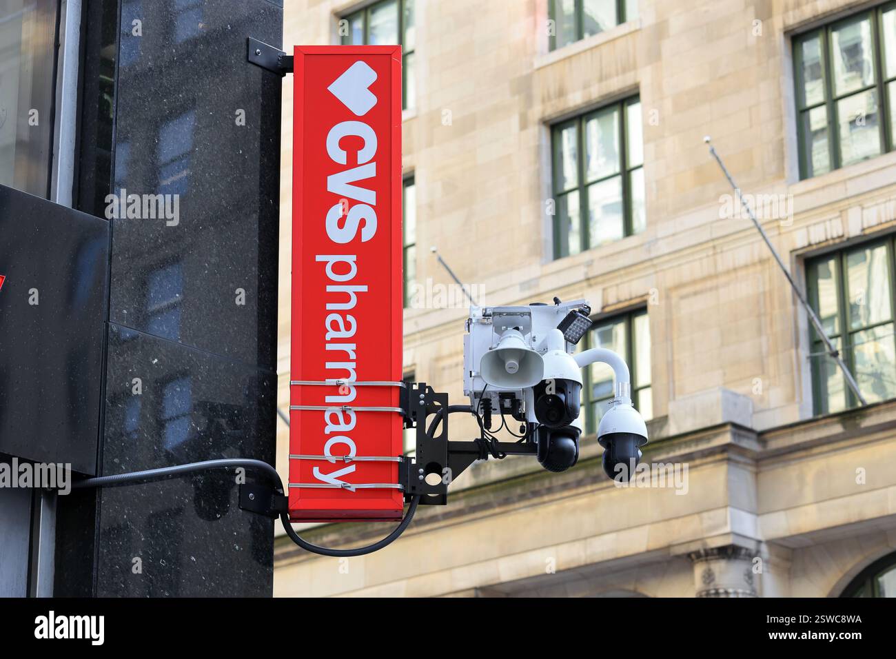 Private security cameras and loudspeaker attached to the signage of a ...