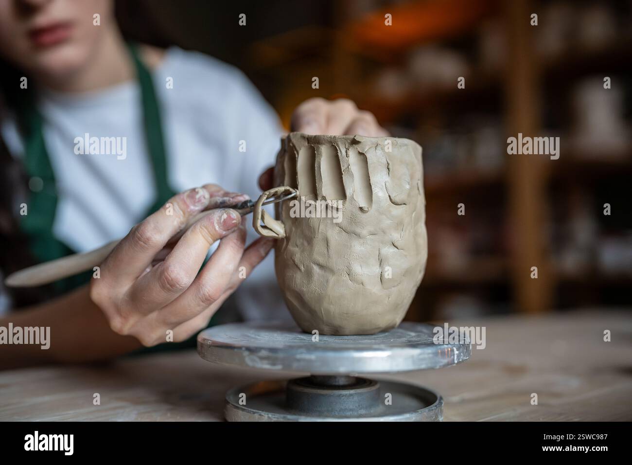 Ceramics creation process. Female artist shaping and sculpting clay ...