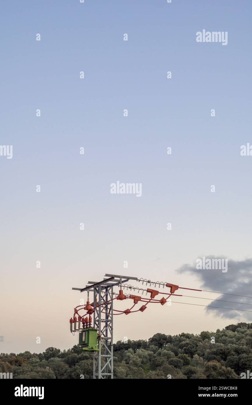 Small electric tower in hydroelectric power station with light ...