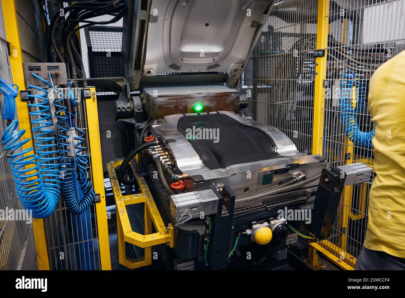 Industrial molding machine in a factory setting showcasing a complex ...