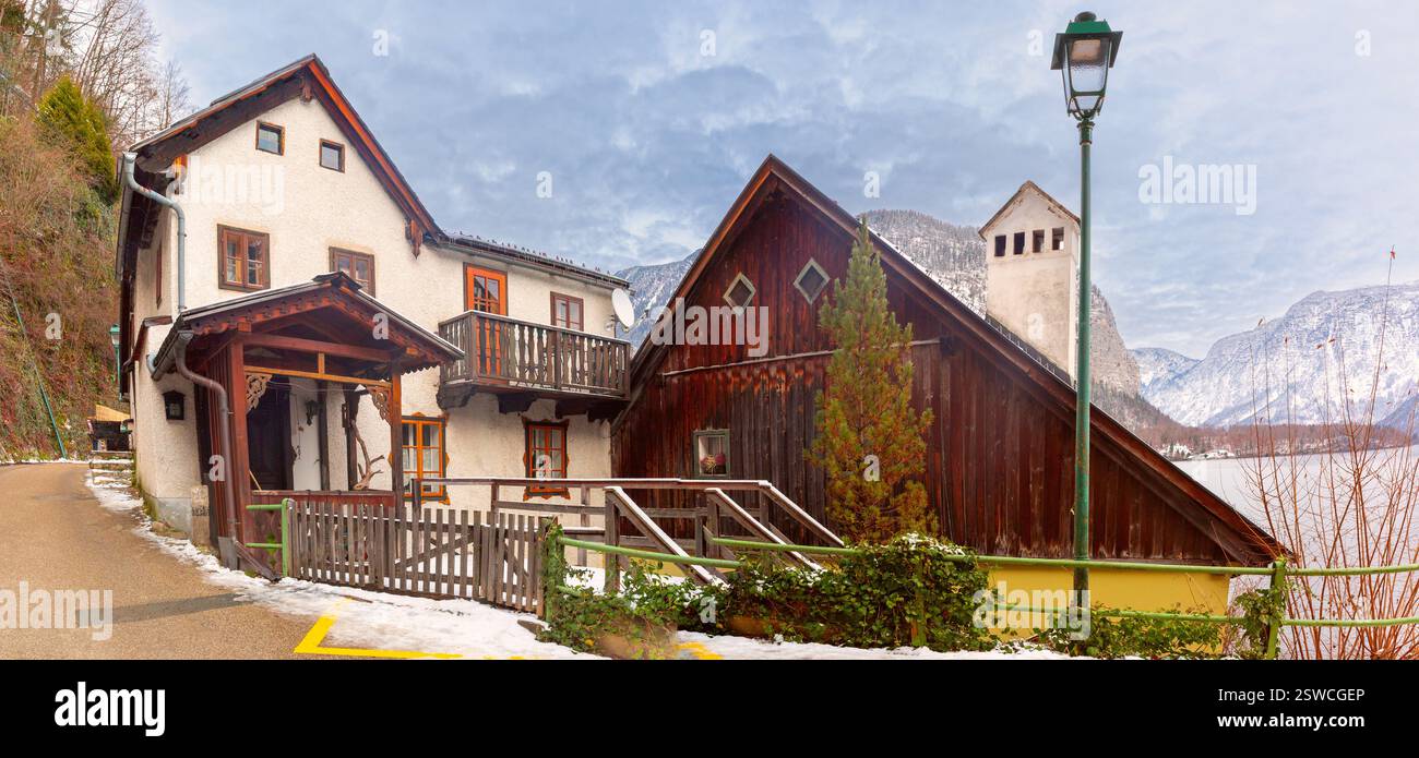 Rustic alpine houses in Hallstatt, Austria, featuring wooden balconies ...