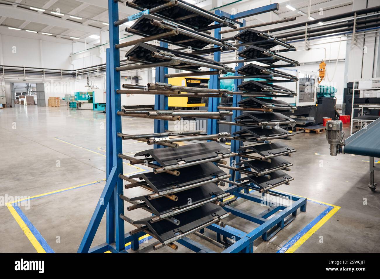 Storage rack holding manufactured parts in industrial facility ...