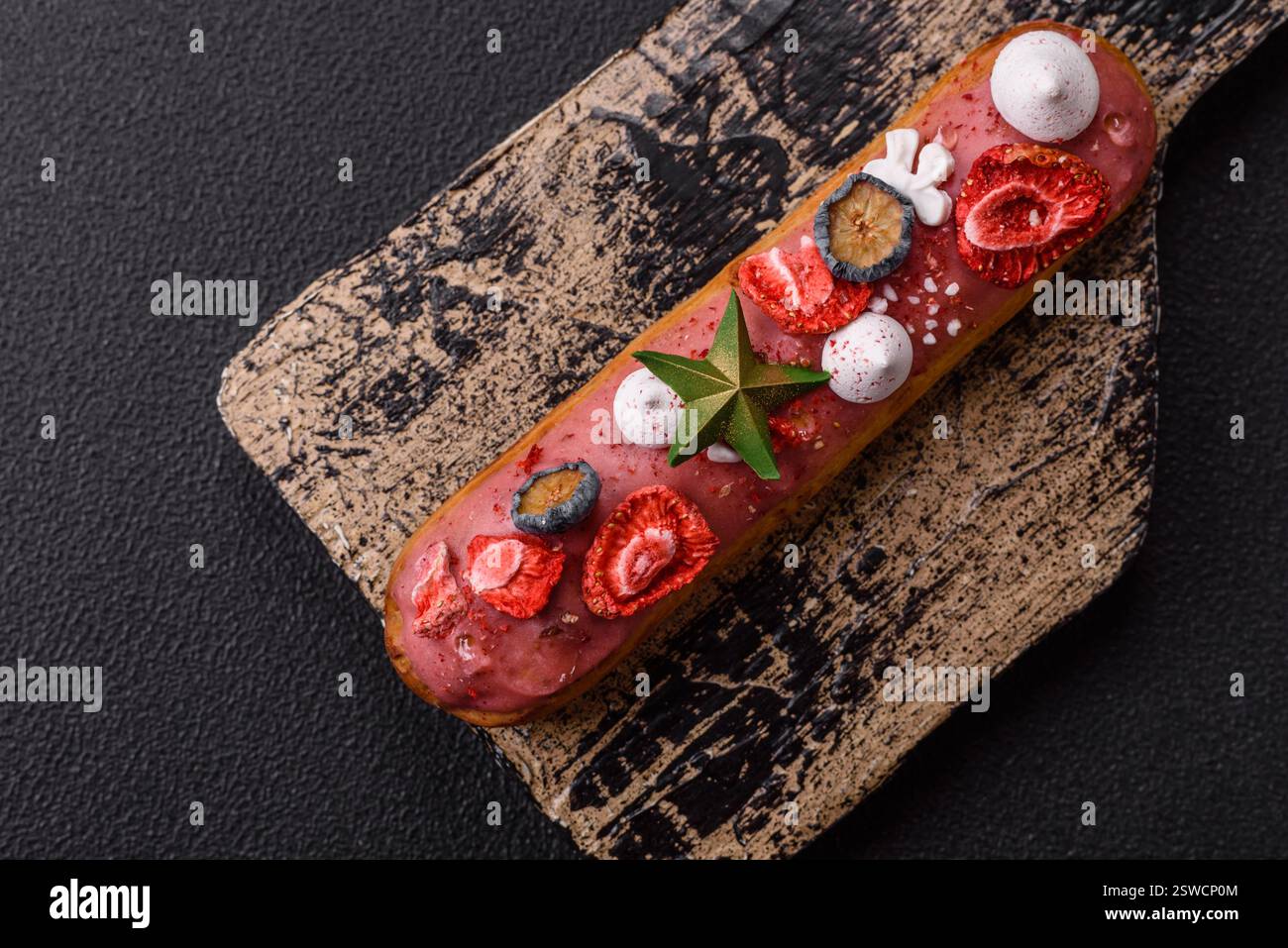 Sweet eclair with chocolate filling, decorated for Christmas Stock ...