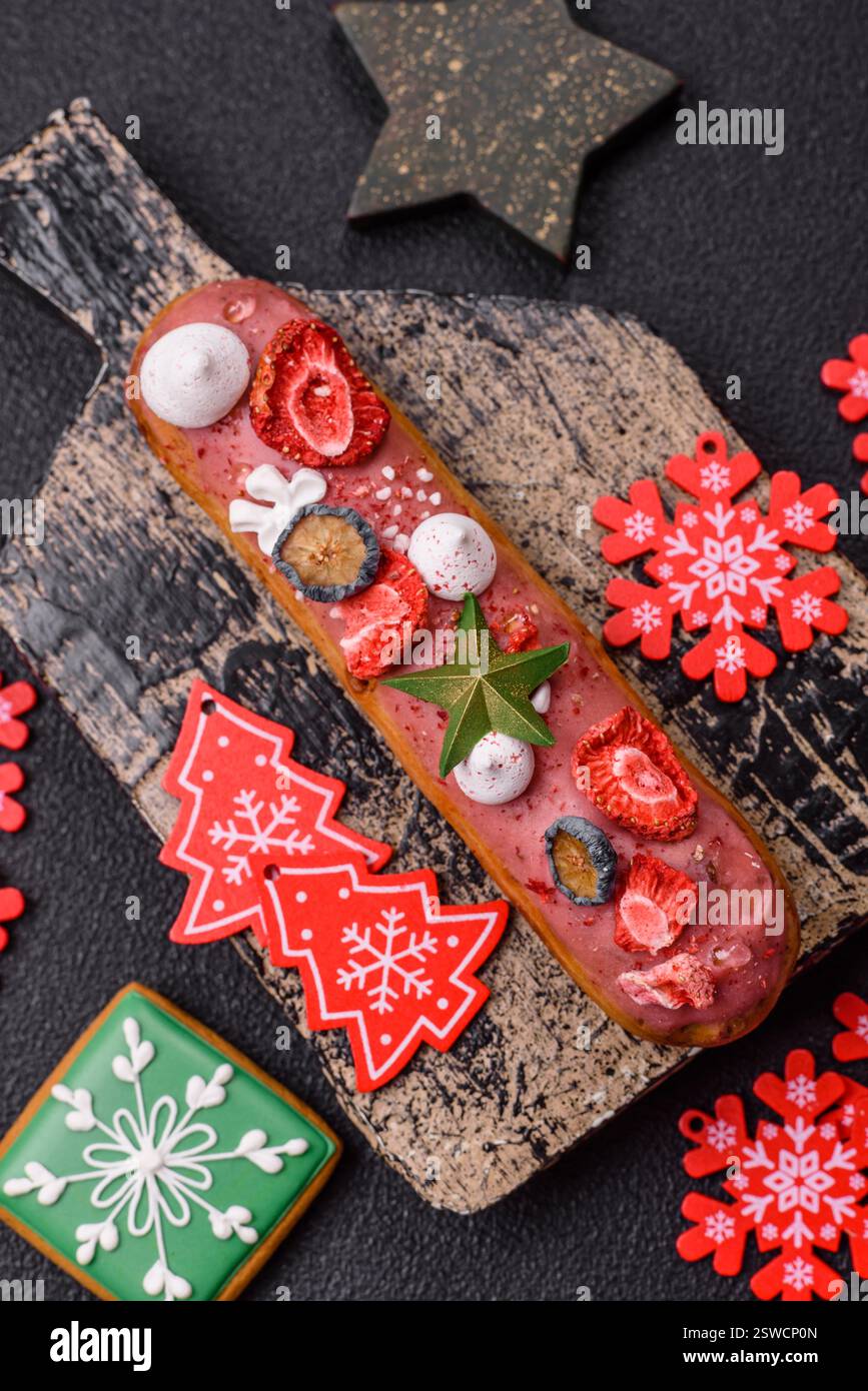 Sweet eclair with chocolate filling, decorated for Christmas Stock ...