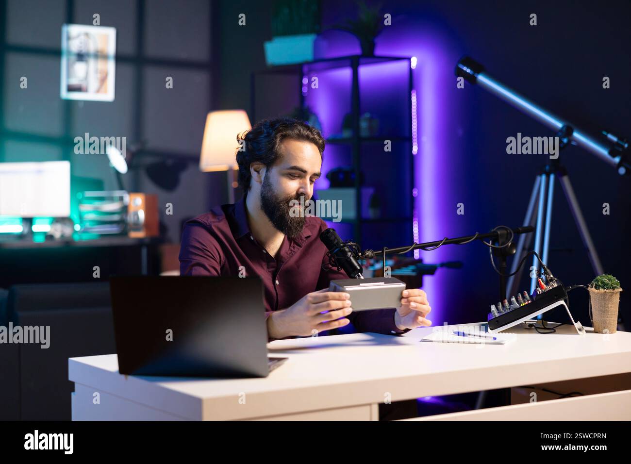 Happy internet star doing technology review of Bluetooth portable ...