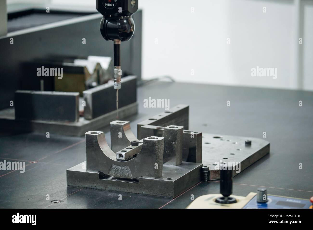 Precision measurement: CMM probe touching metal part ensuring accuracy ...