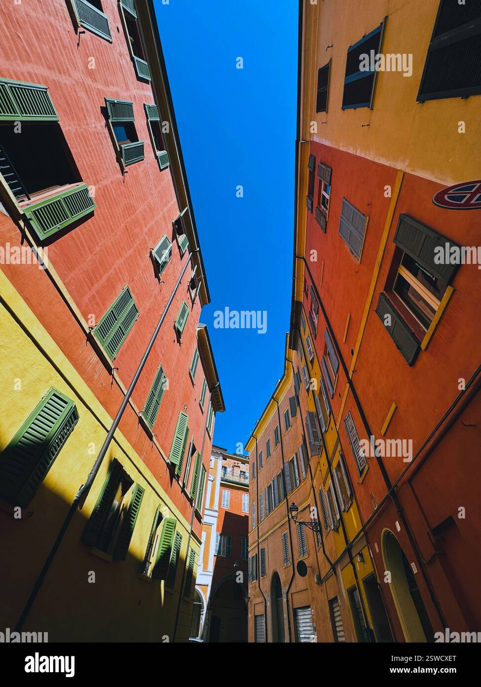 Vibrant Colorful Alleyway Located Under A Clear Blue Sky Filled With ...
