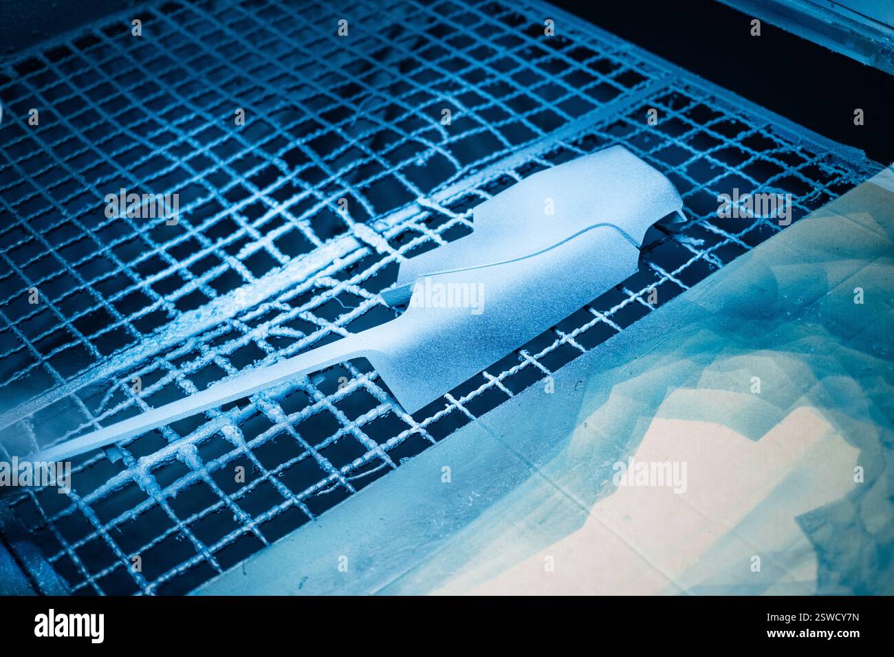 Delicate design emerging a single piece rests on grid with a cool ...