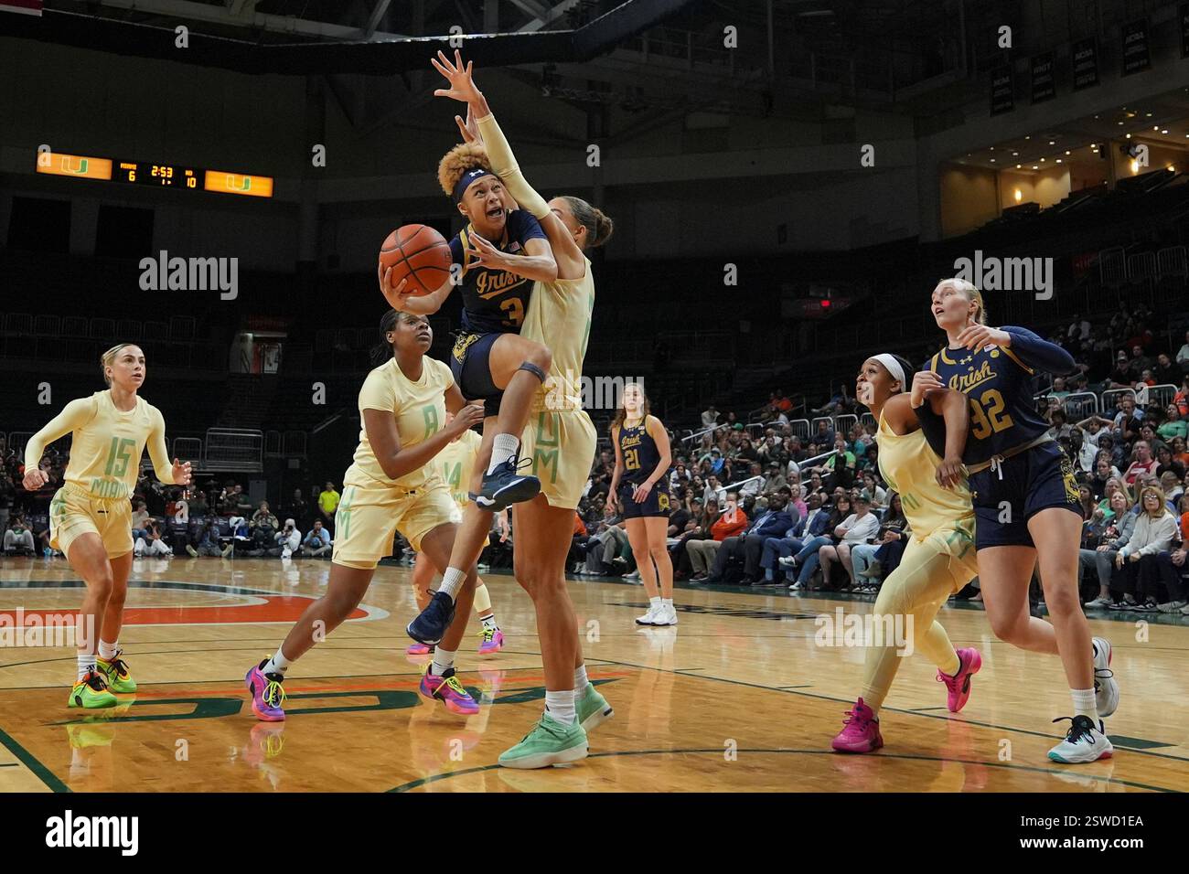 Notre Dame guard Hannah Hidalgo (3) jumps past Miami forward Natalija Marshall to shoot in the ...
