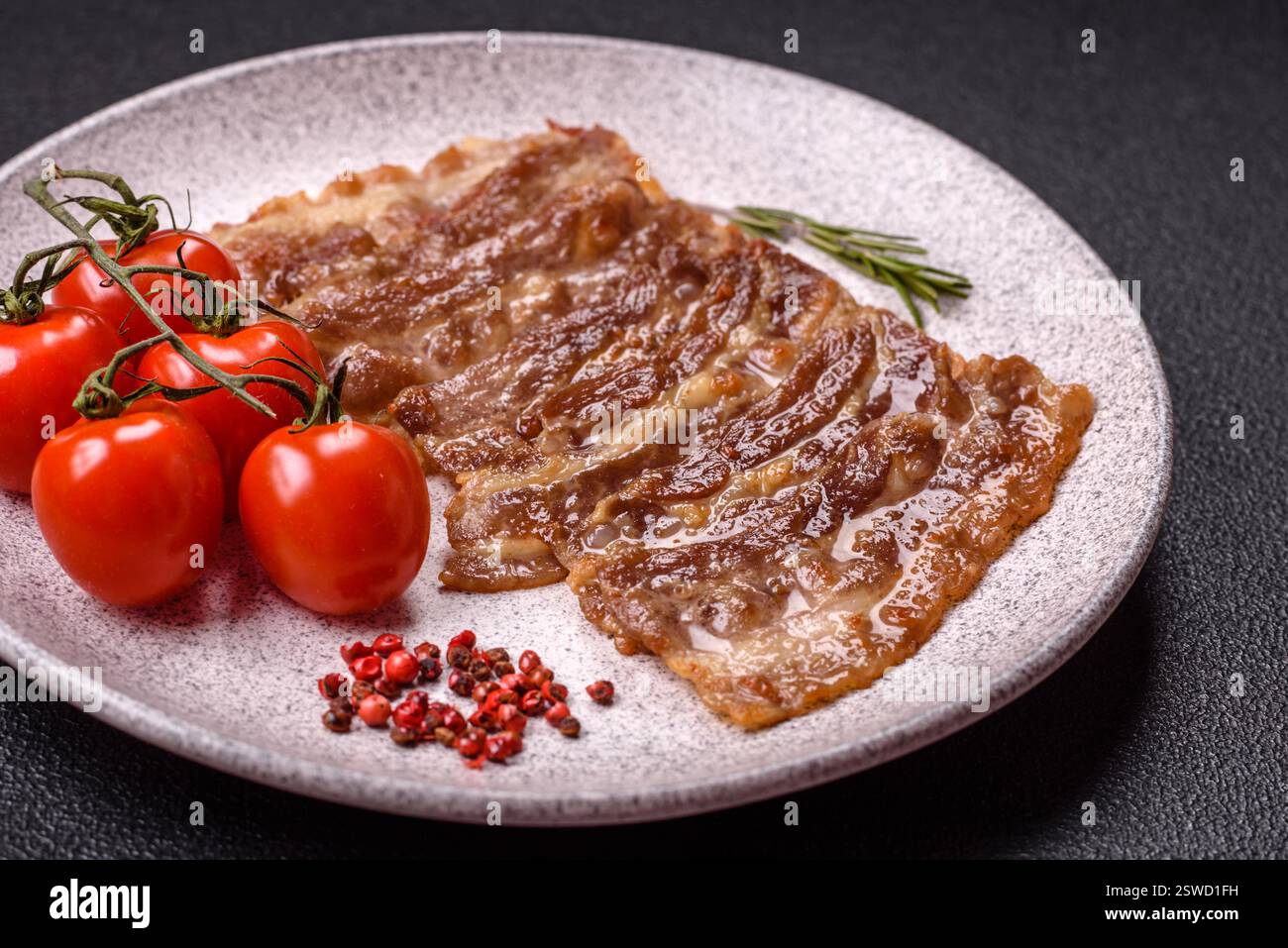 Crispy fried pork bacon sliced with salt, spices and herbs Stock Photo ...