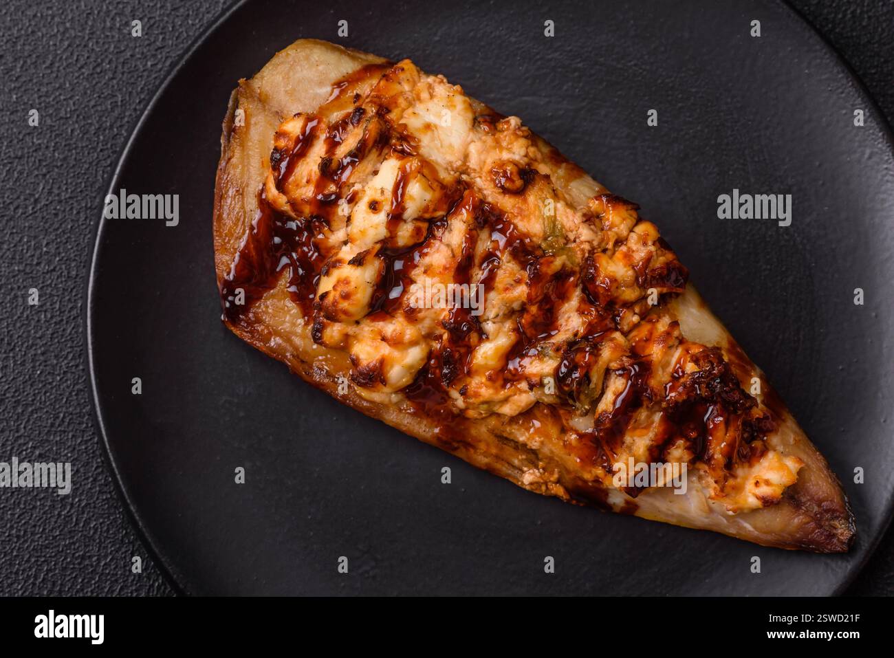 Grilled mackerel fillets with cheese, salt, spices and herbs on dark ...