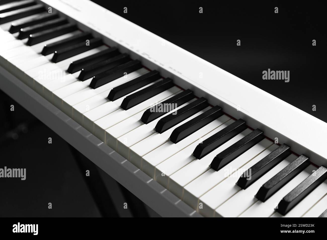 Synthesizer on black background, closeup. Electronic musical instrument ...