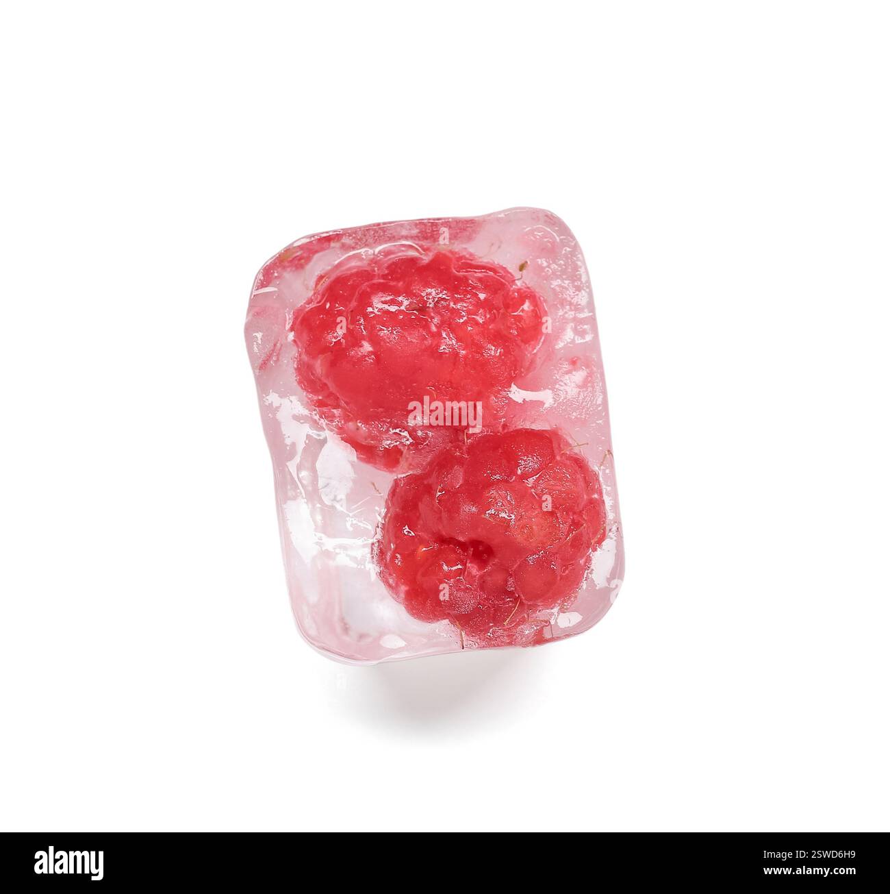 Frozen raspberries in ice cube on white background Stock Photo - Alamy
