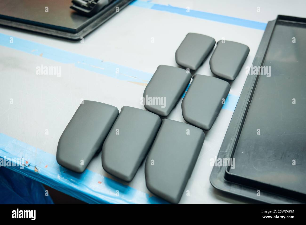 Gray components neatly arranged reflecting precision and quality ...