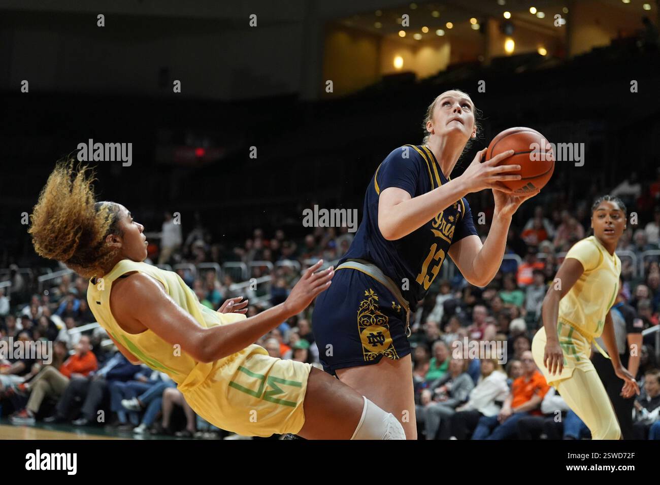 Notre Dame forward Kate Koval (13) fouls Miami forward Cameron Williams ...