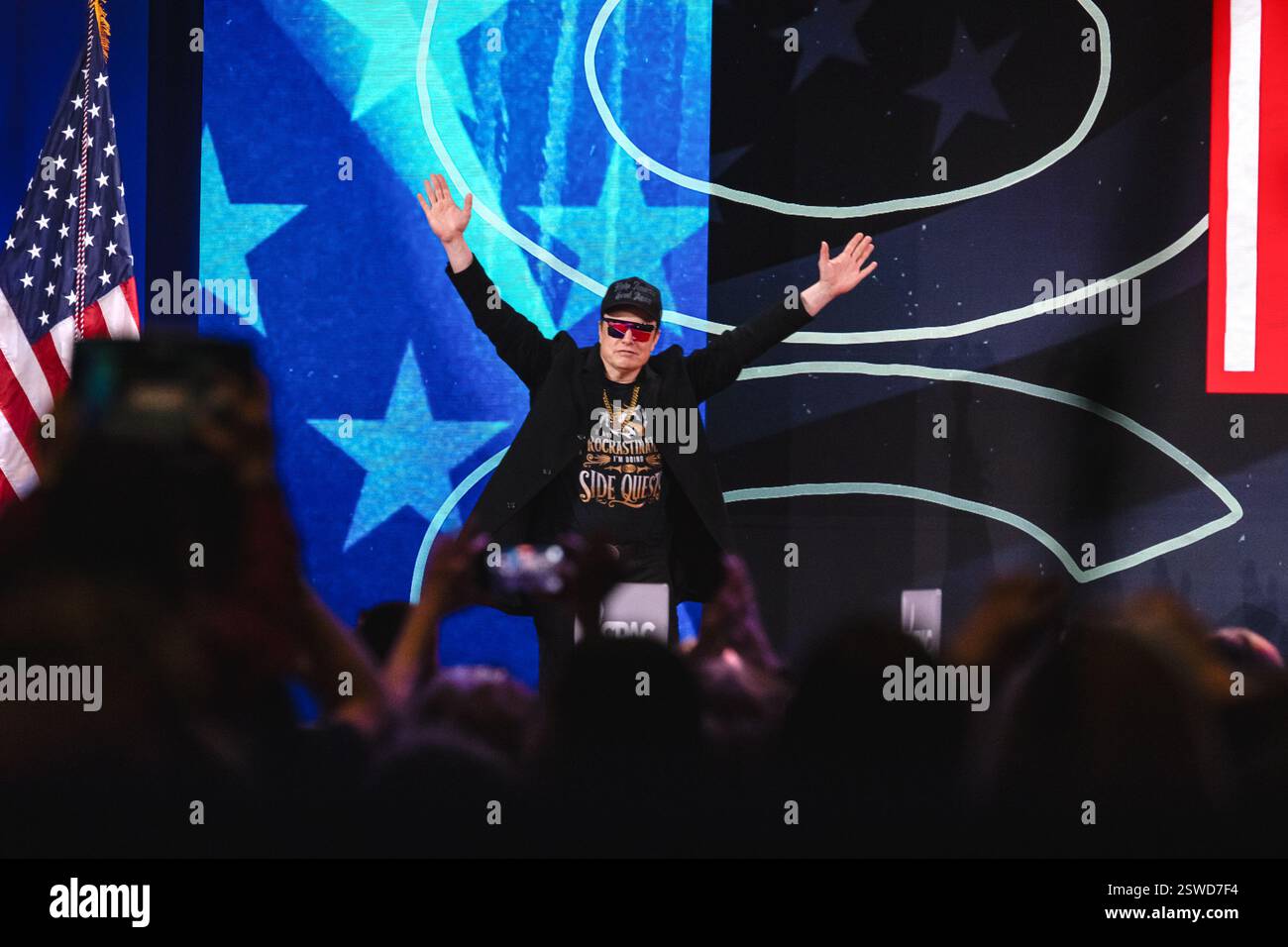 Elon Musk takes the stage on the first day of CPAC 25, in Washington DC ...