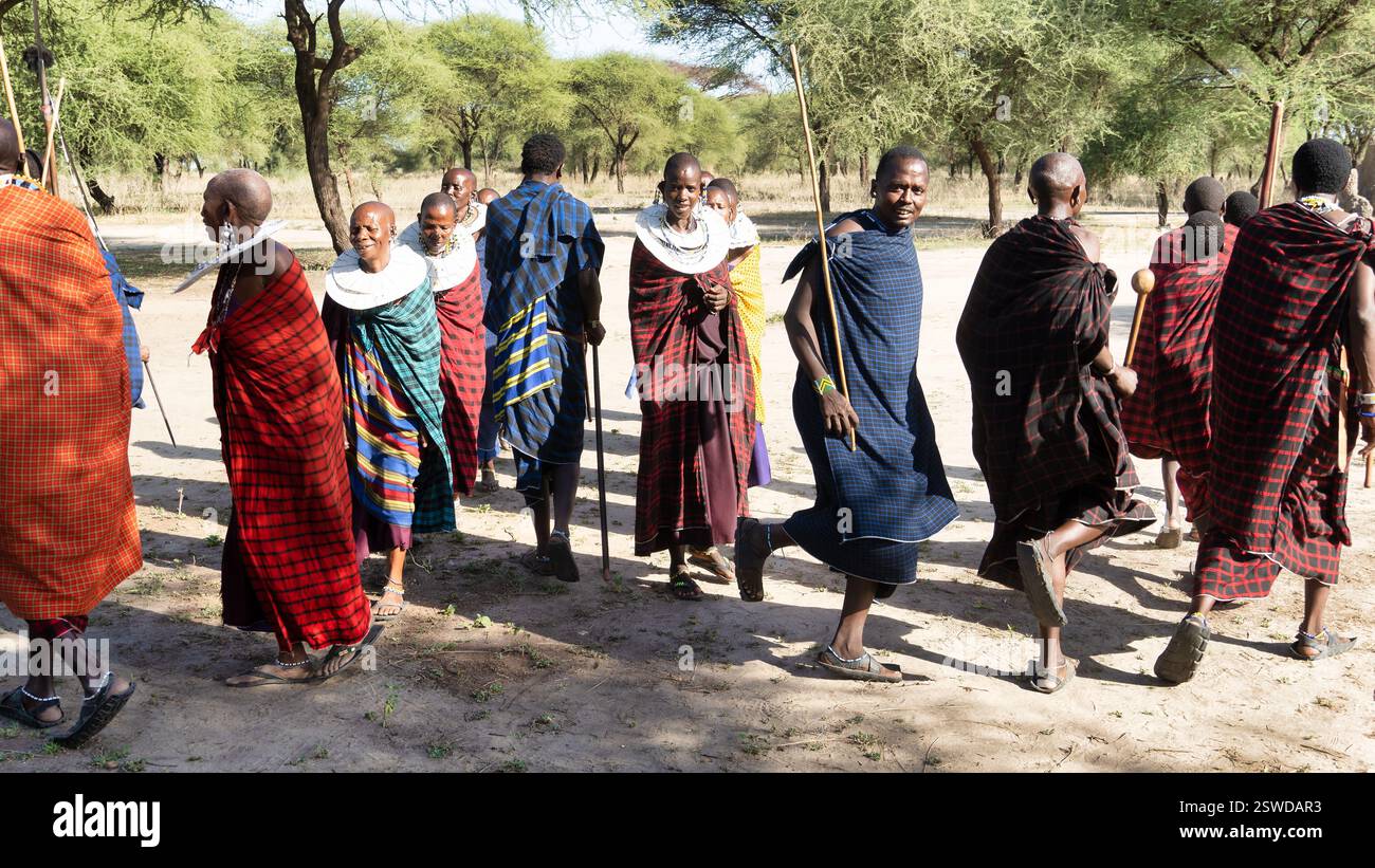 Maasai men and women showcasing their vibrant traditional attire and ...