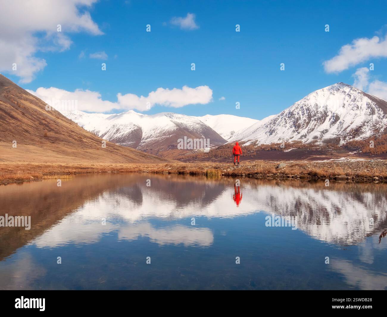 Snow capped mountain reflected in clear water Stock Photo - Alamy