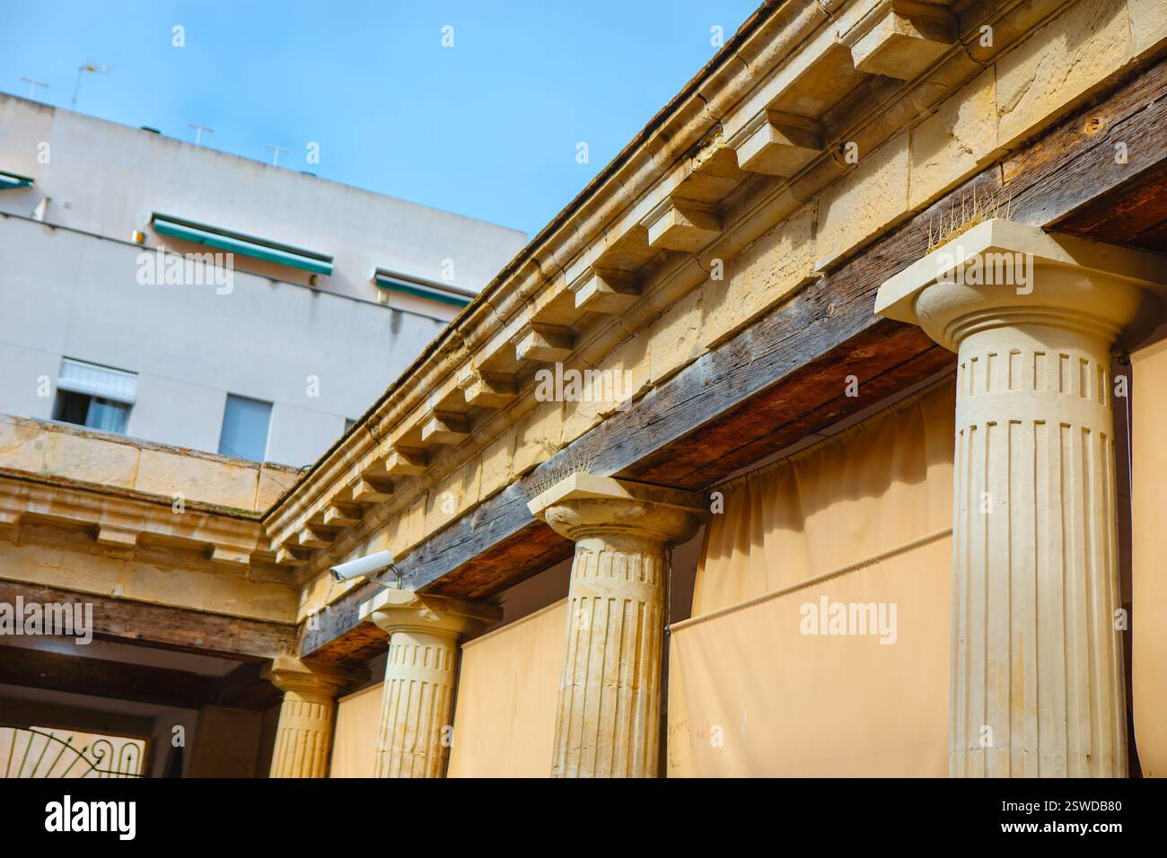 Section of building with classical architectural elements, fluted ...