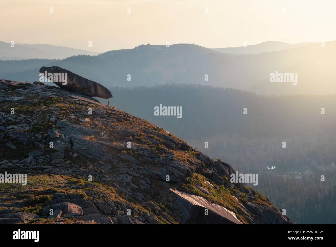 Falling large boulder on the edge of the abyss. Sunset view, Western ...