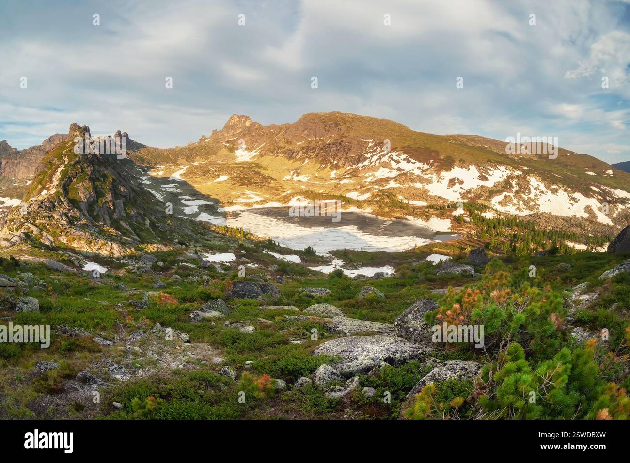 Minimalistic beautiful mountain scenery with golden light on snow ...