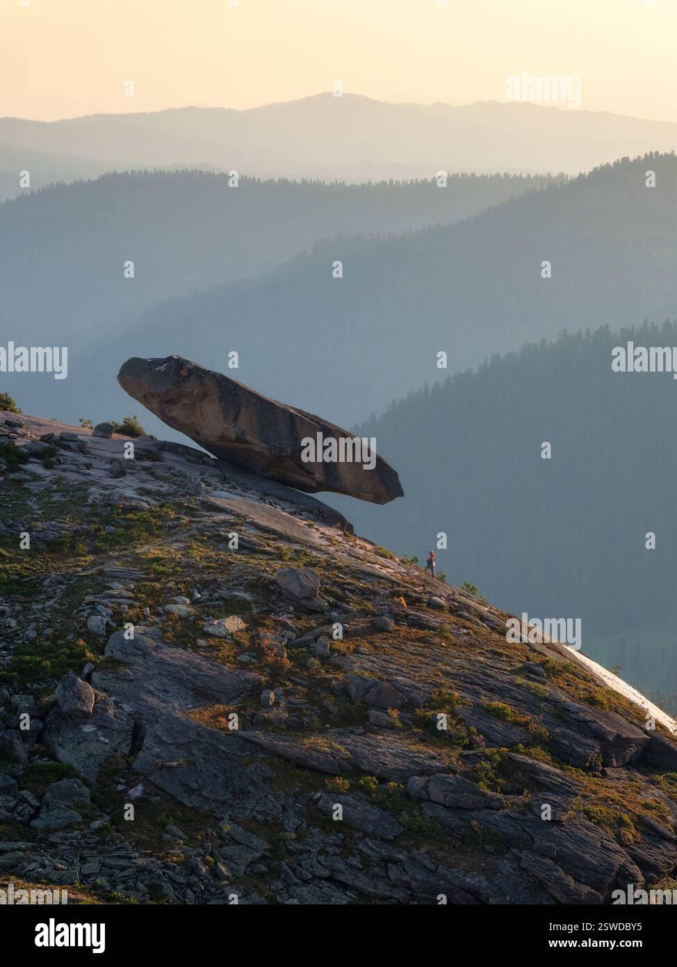 Falling large boulder on the edge of the abyss. Vertical view, Western ...