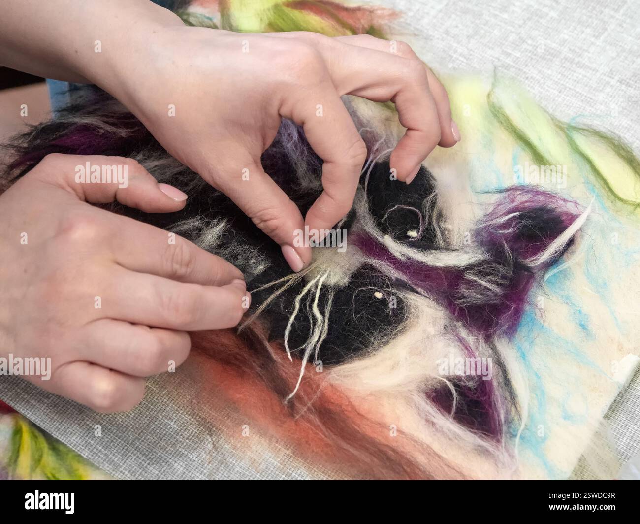 Process of creating a picture of wool. Contemporary art - felting wool ...