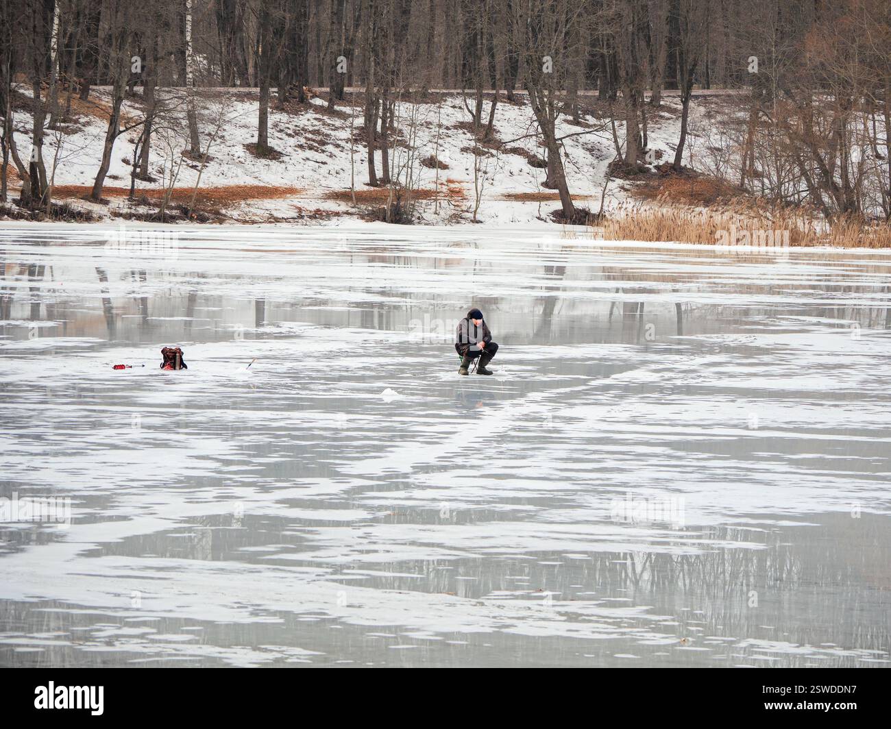Person ice fishing on melting hi-res stock photography and images - Alamy