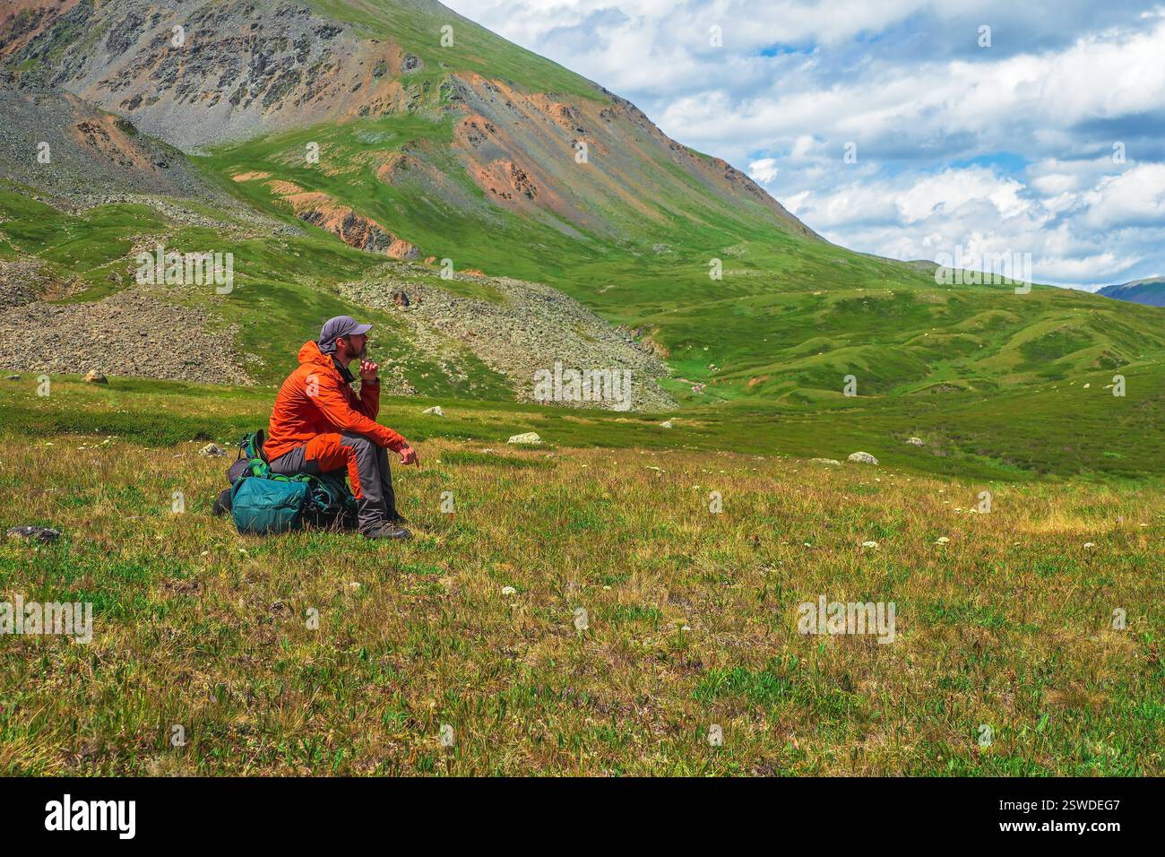 Daydreaming while sitting in nature. Rest time on a hike, a rest stop ...