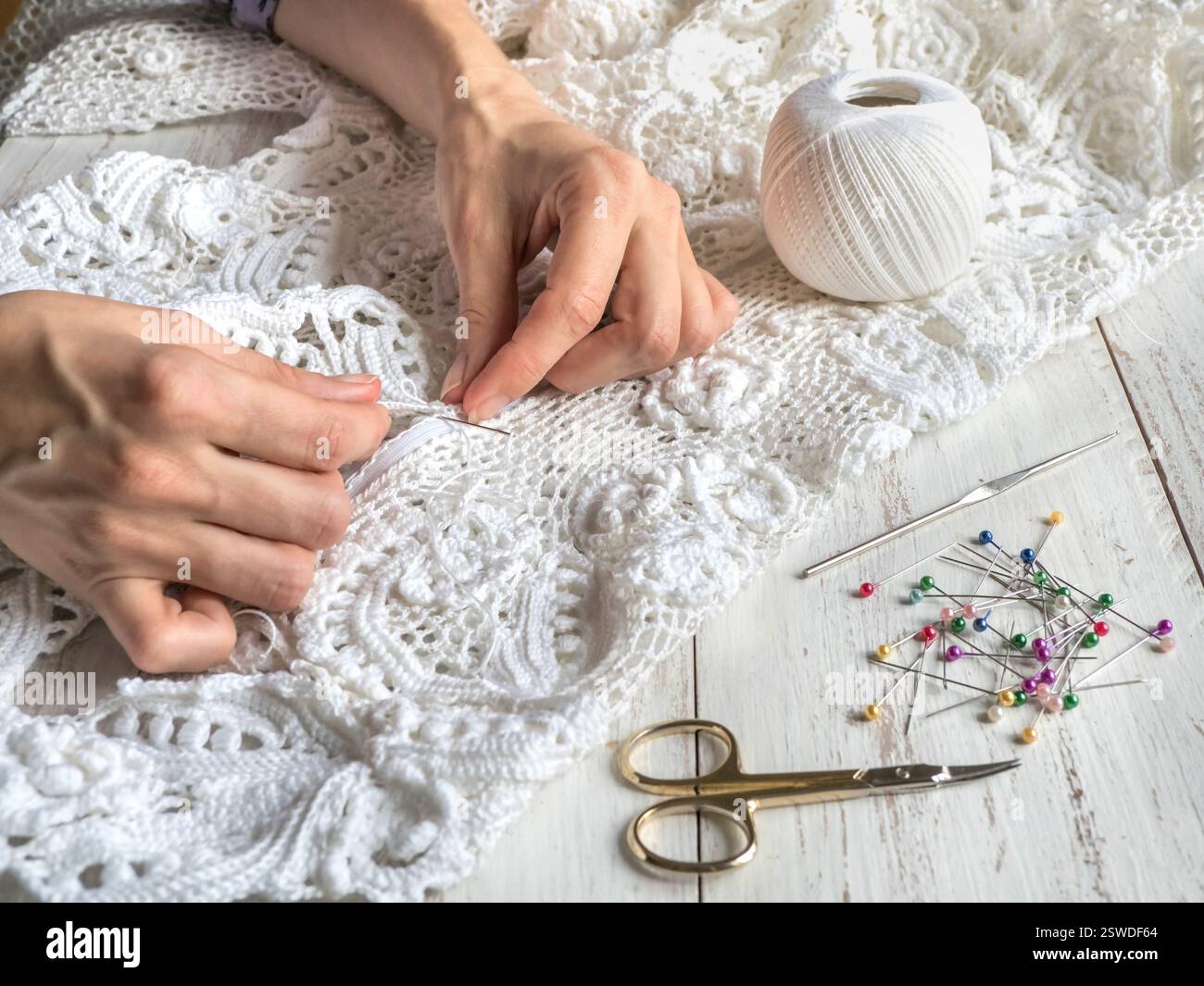 Irish lace, handmade, wedding dress tailoring Stock Photo - Alamy