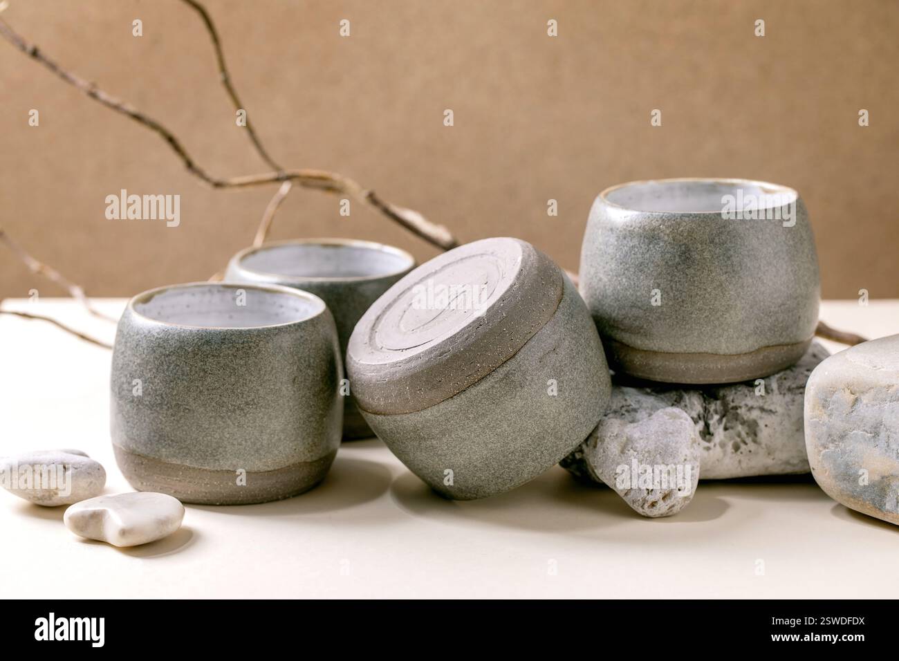 Set of empty grey ceramic cups Stock Photo - Alamy