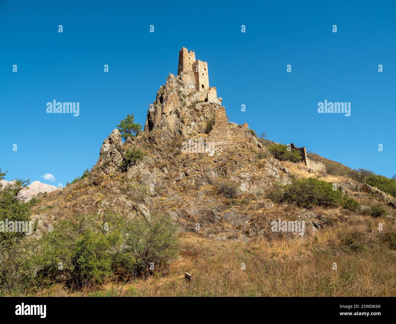 Hard-to-reach ancient battle towers on the rocks. Unique medieval tower ...