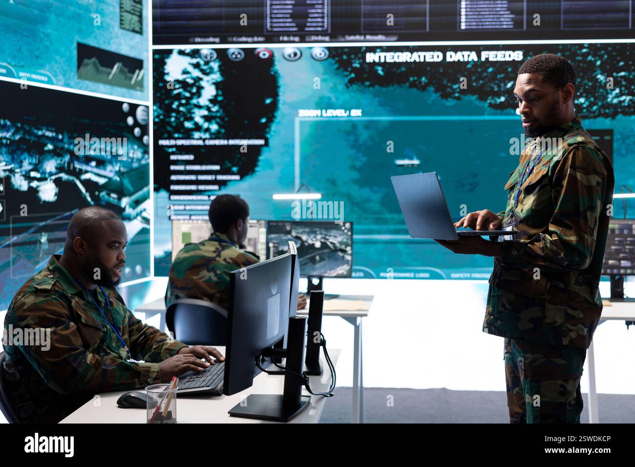 Soldiers in a modern command center analyze live data from cctv radar ...