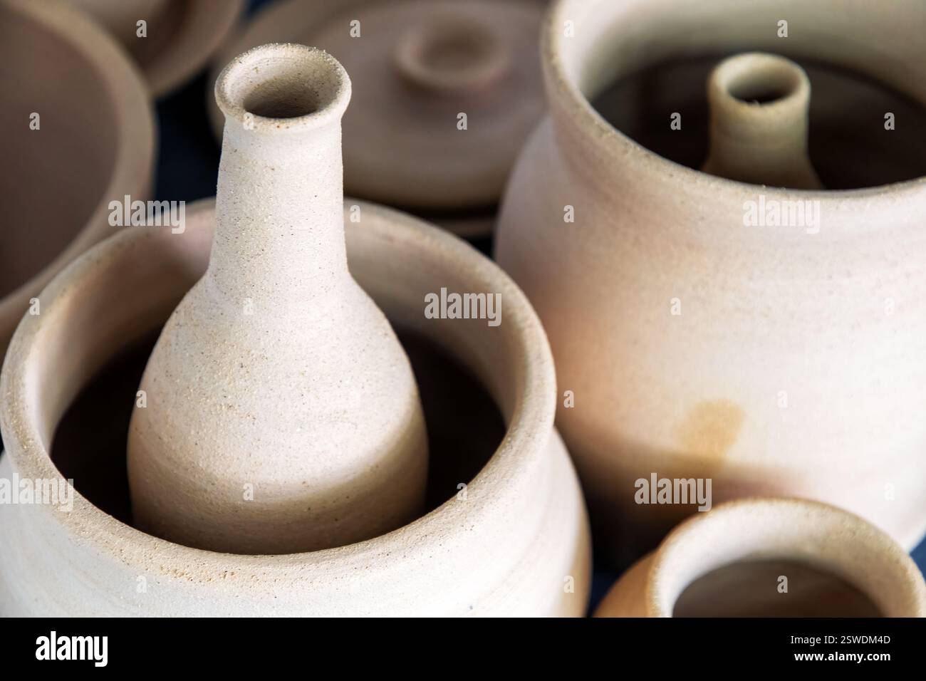 Collection of rustic ceramic pottery pieces, highlighting their unique ...