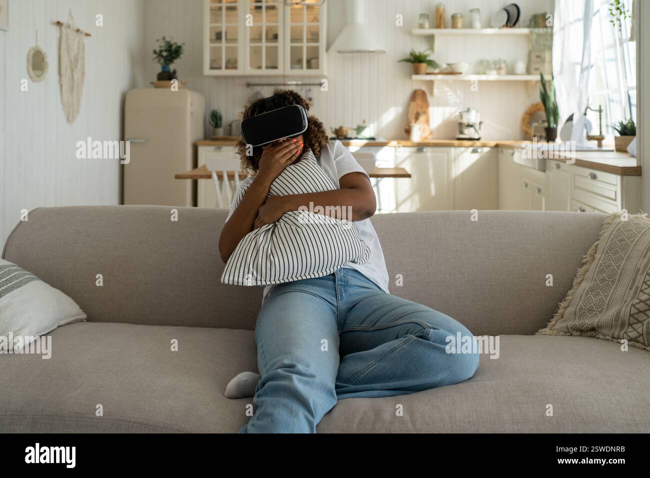 Shocked African American woman in virtual reality goggles feel scared ...