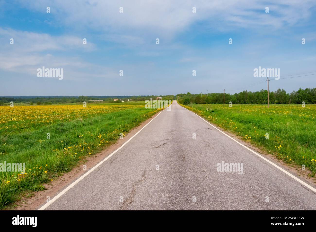 Straight highway through green fields hi-res stock photography and images - Alamy