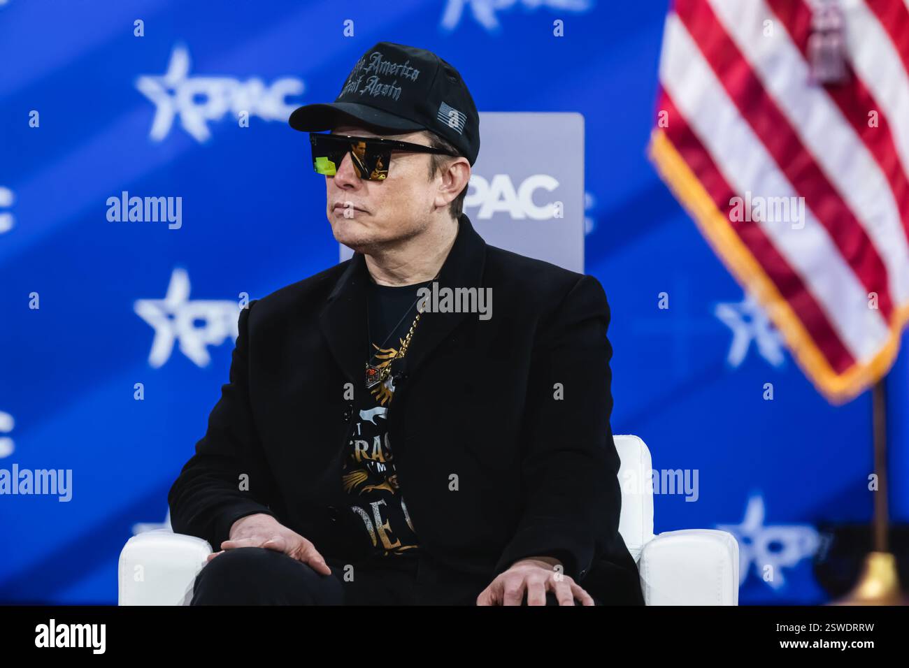 Elon Musk takes the stage on the first day of CPAC 25, in Washington DC ...