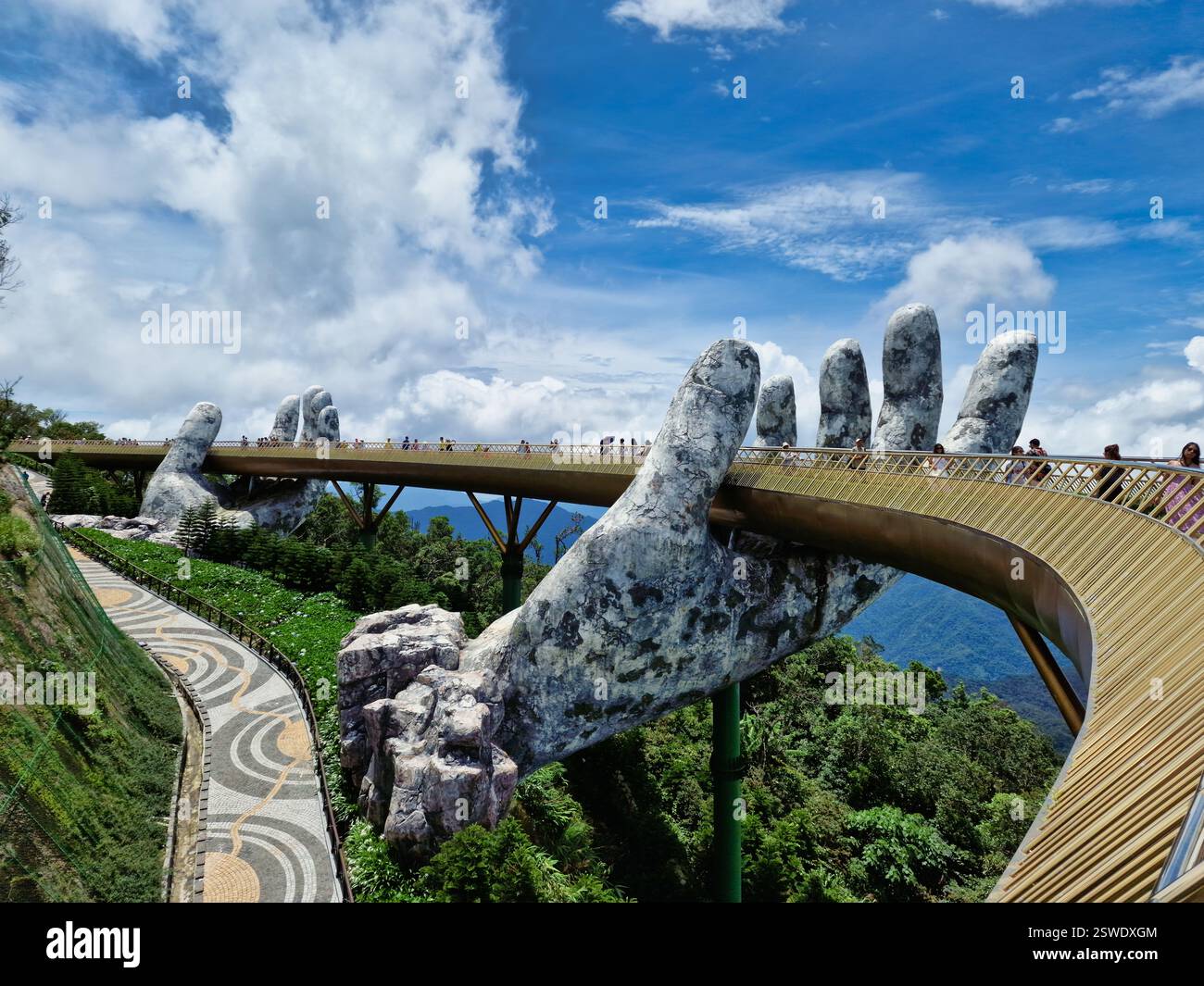 A beautiful bridge with a hand statue that blends well with the ...