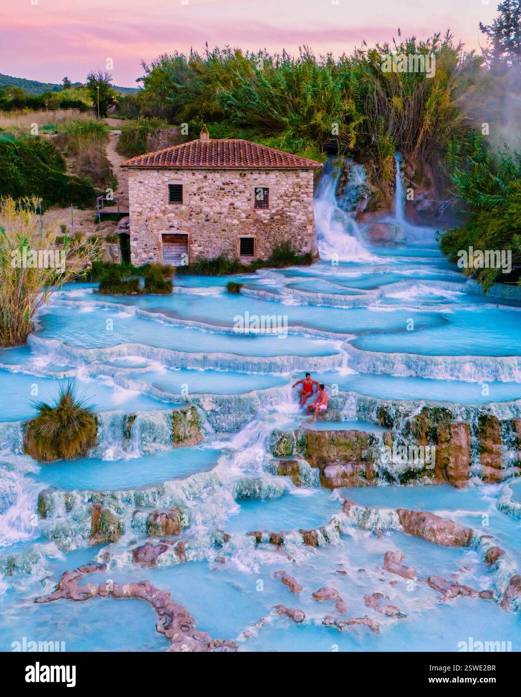 Relaxing in the natural thermal springs of Saturnia under a vibrant ...