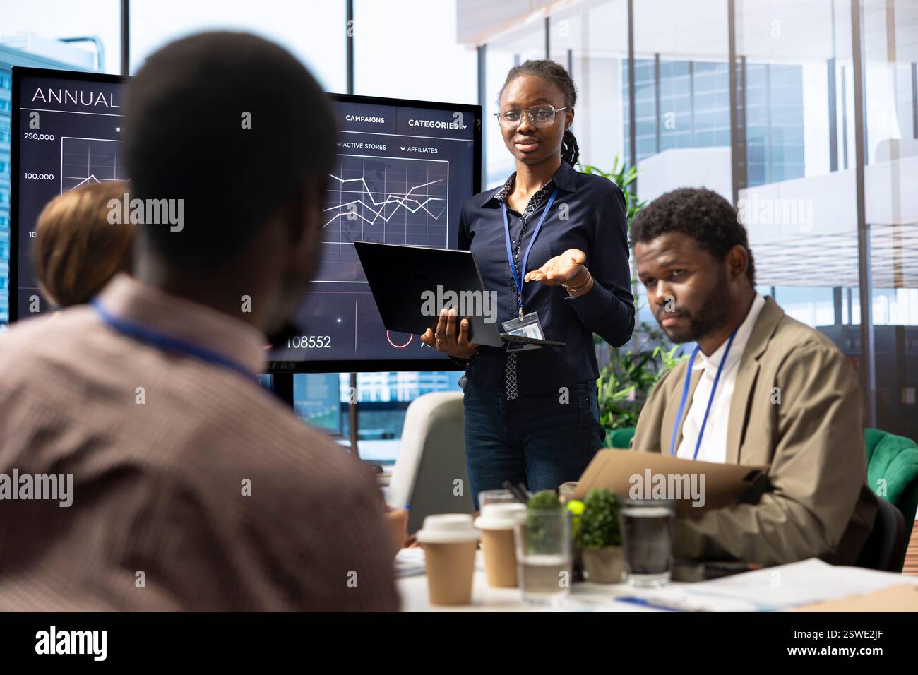 Diverse group of business professionals meeting to strategize on ...