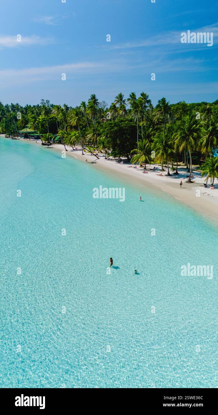 Soft turquoise waves lap against pristine white sands on Koh Kood ...