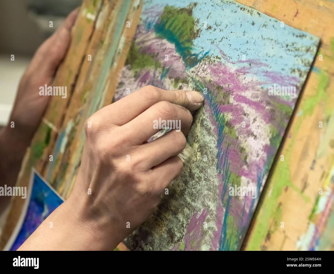 Hand is in motion. Drawing with pastels close-up. Woman drawing ...