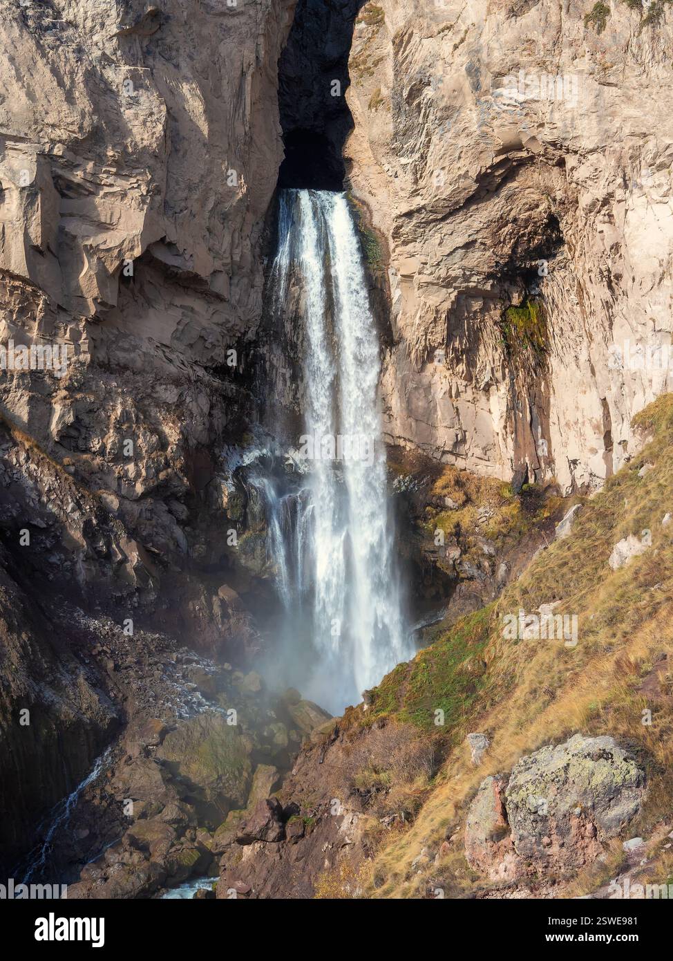 Scenic autumn landscape with vertical big Sultan waterfall at mountain ...