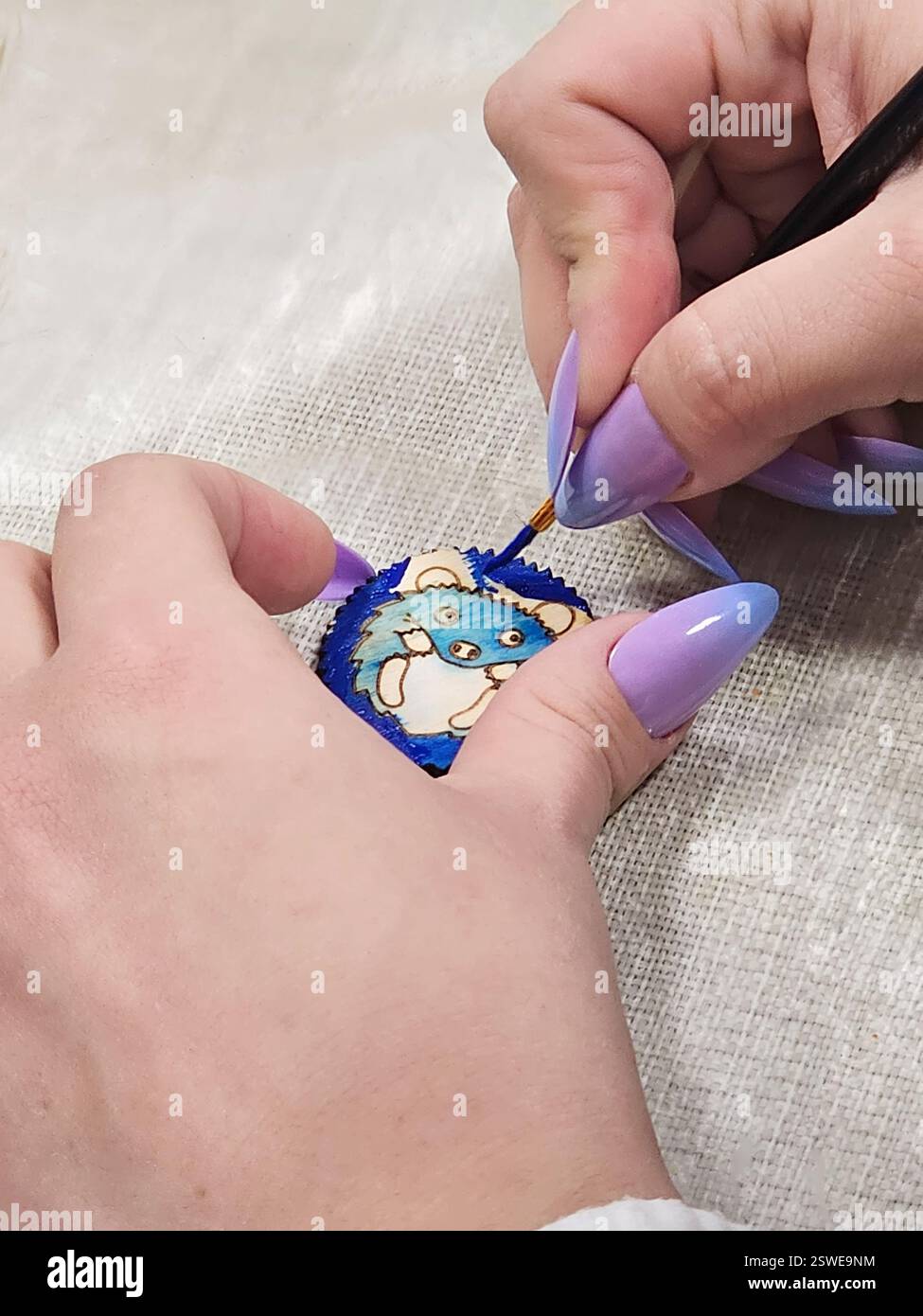 The art process of pouring epoxy resin into a wooden toy. Technology ...