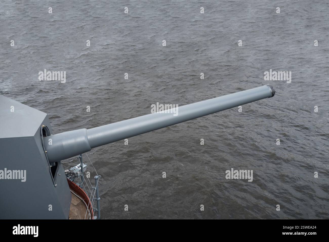 Naval gun. Gun on the gray water background Stock Photo - Alamy
